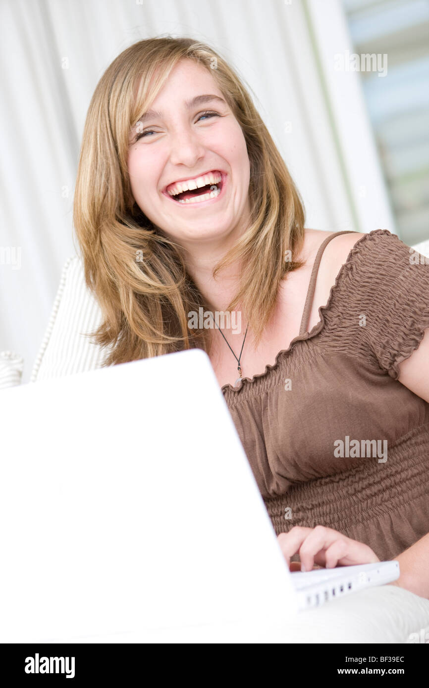 Teenage Girl on laptop computer Stock Photo - Alamy