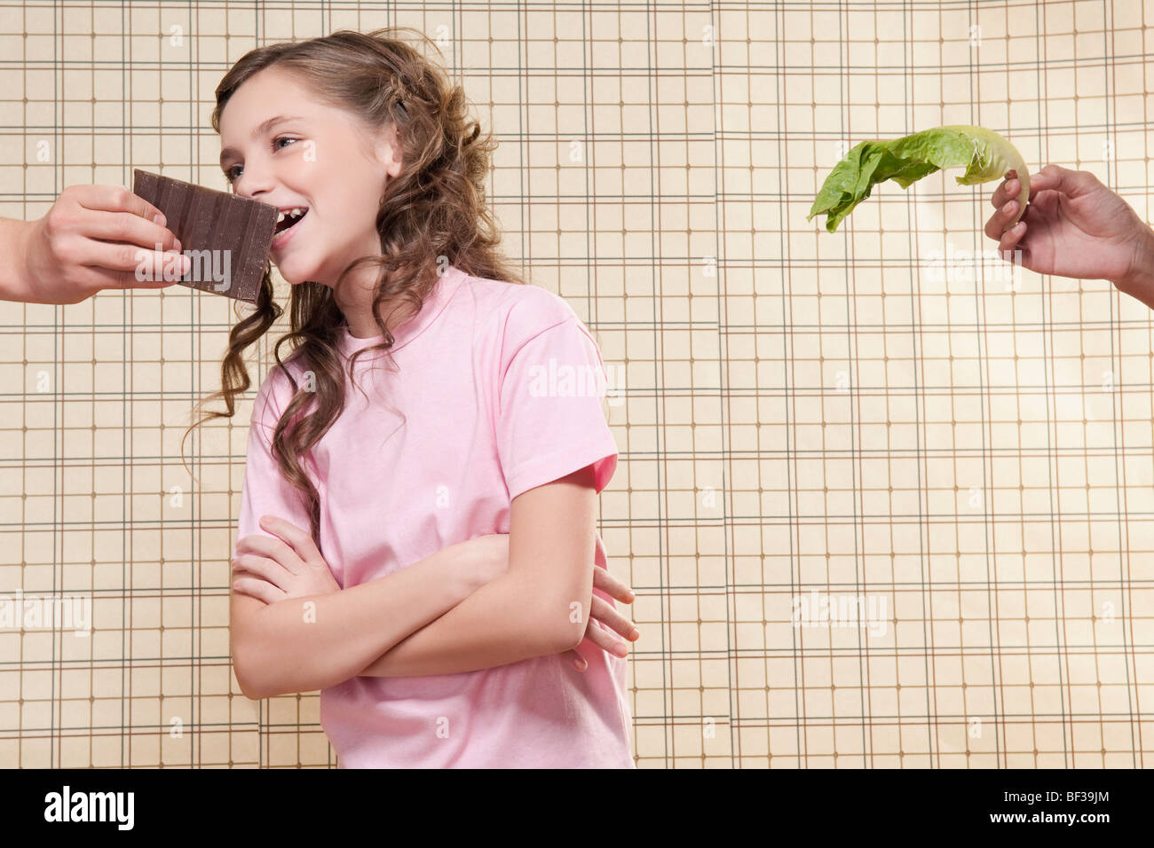 Girl eating chocolate Stock Photo - Alamy