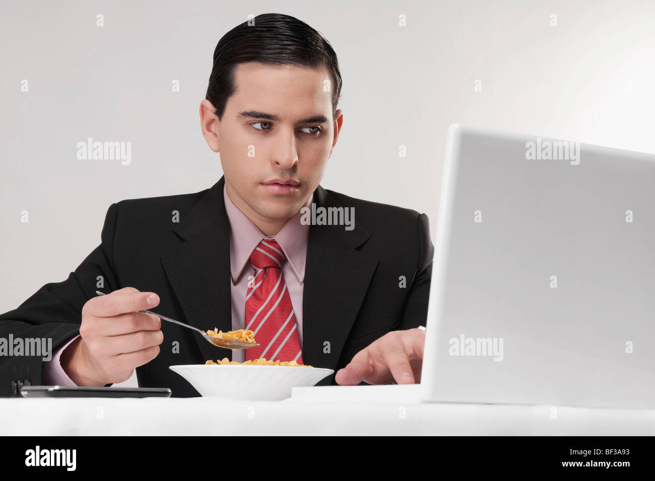 Businessman eating breakfast in home hi-res stock photography and ...