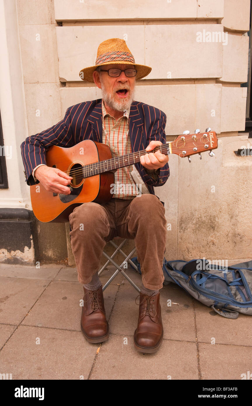 Man playing guitar in street old hi-res stock photography and images ...