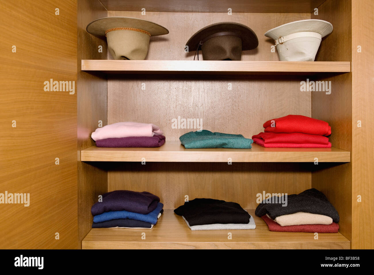Clothes on shelves Stock Photo - Alamy