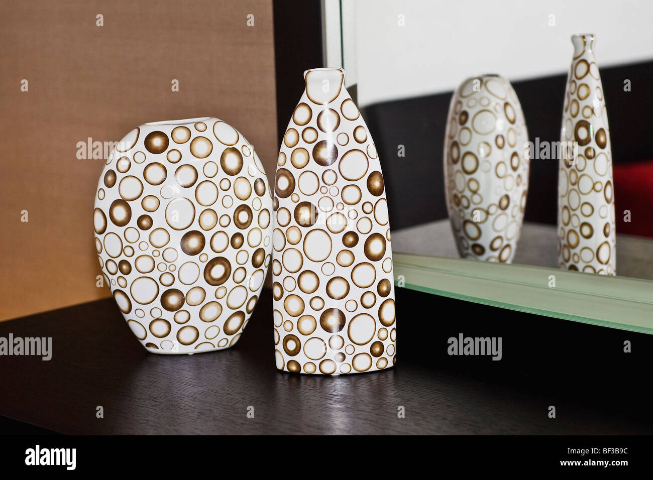 Reflection of two vases in a mirror Stock Photo - Alamy