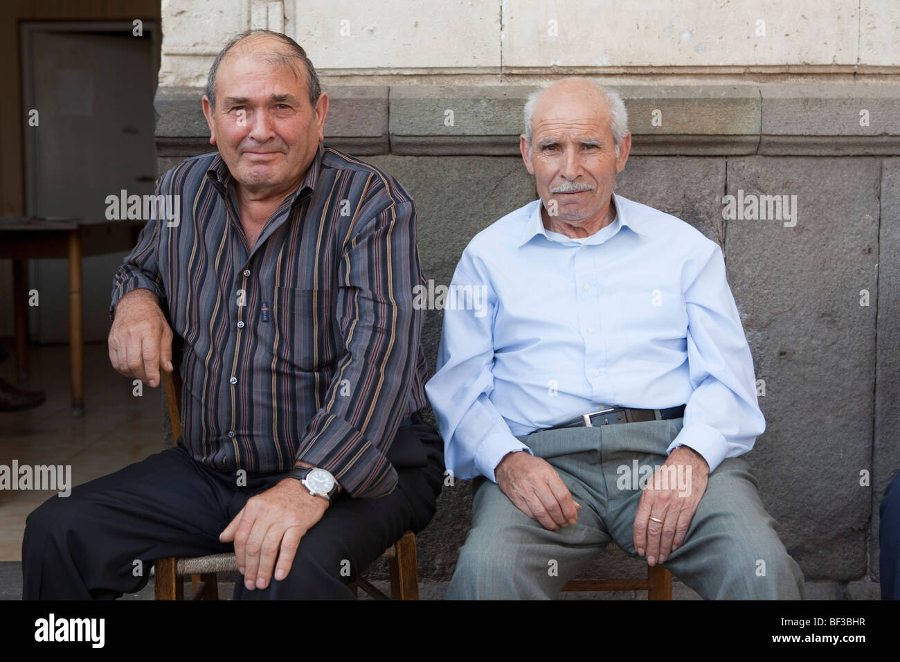 two old men sitting outside Stock Photo - Alamy