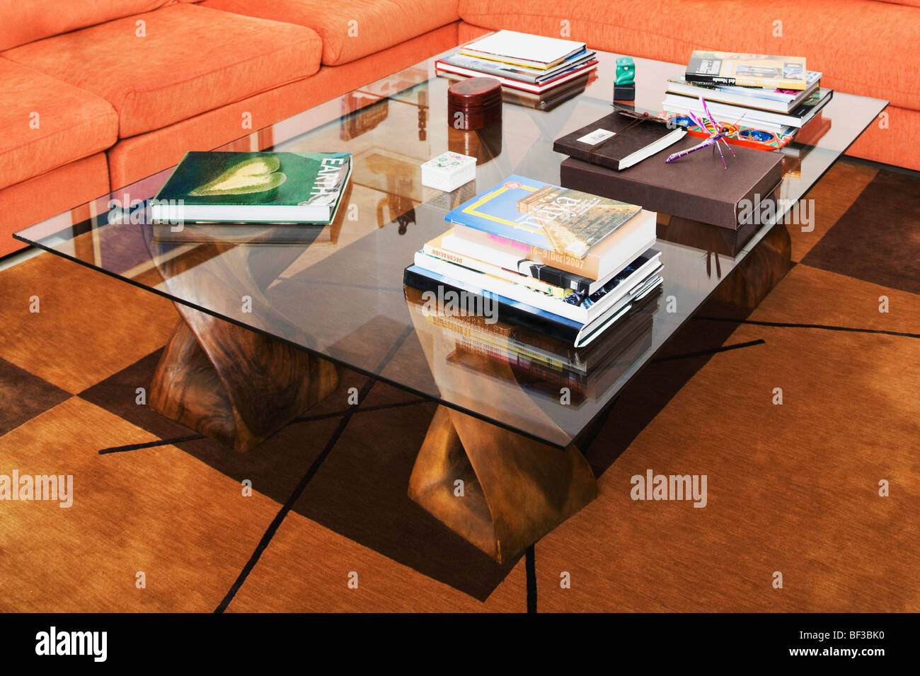 Books on a table in a drawing room Stock Photo - Alamy