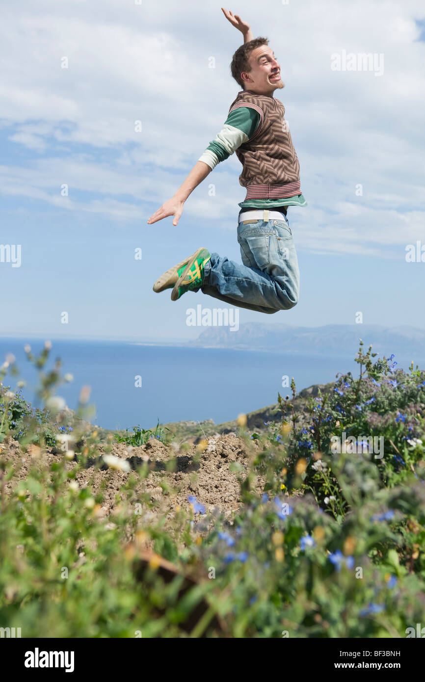 young man jumping in air Stock Photo - Alamy