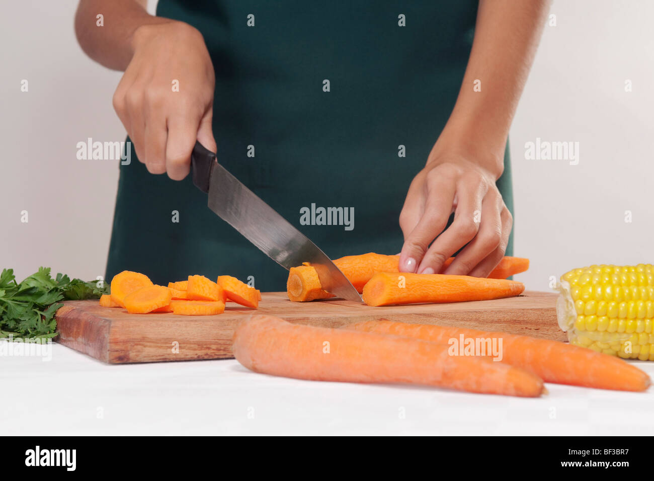 Mid section view of a woman cutting vegetables Stock Photo - Alamy