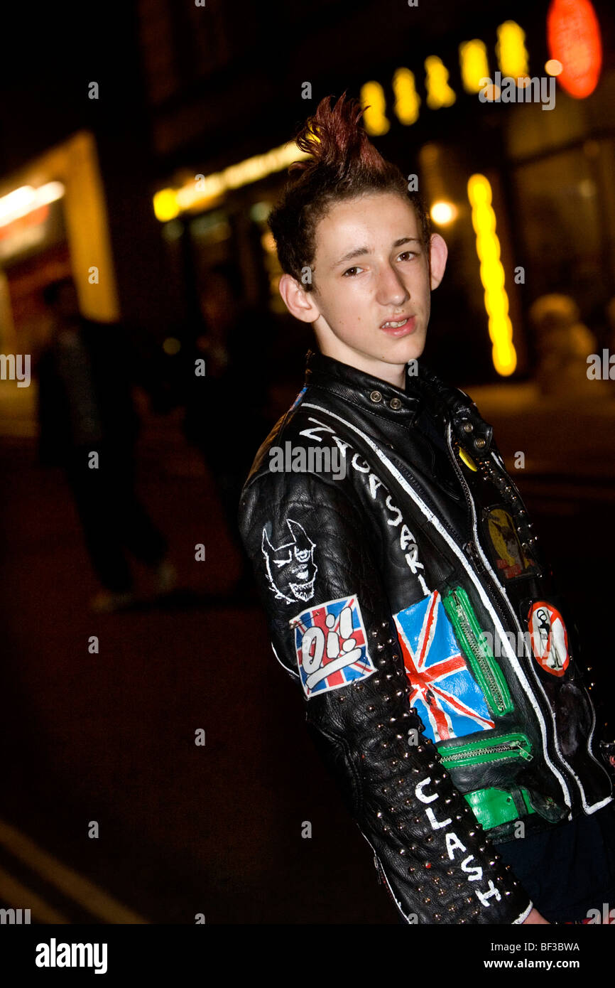 A young modern day sixteen year-old punk rocker pictured queuing to get ...