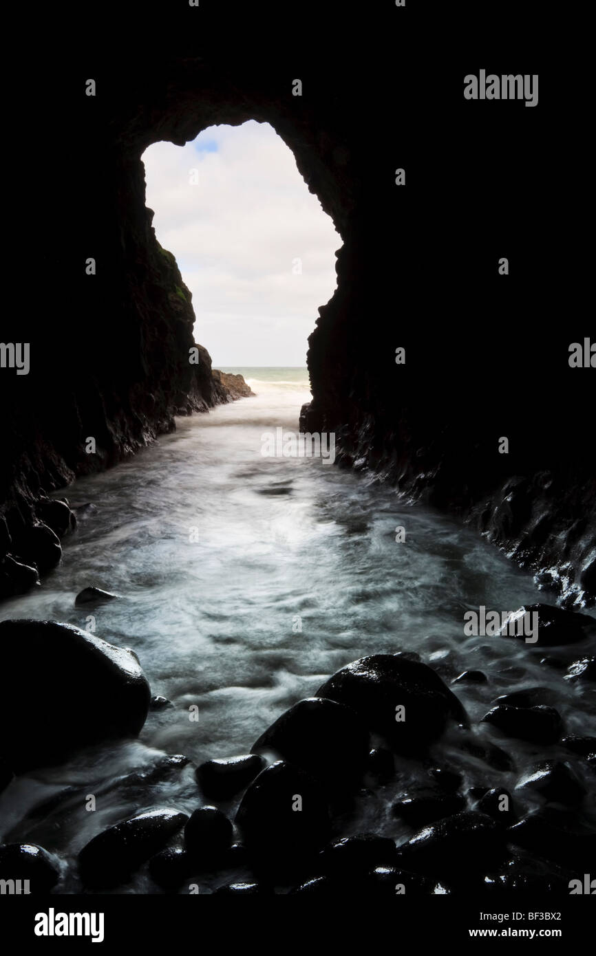The interior of a cave looking out onto the Irish Sea underneath ...