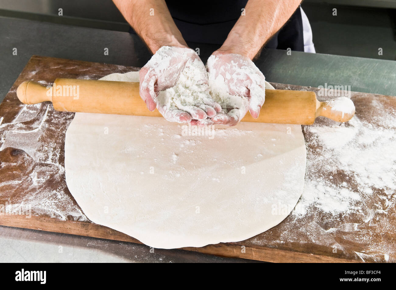 Chef's hands covered with flour Stock Photo - Alamy