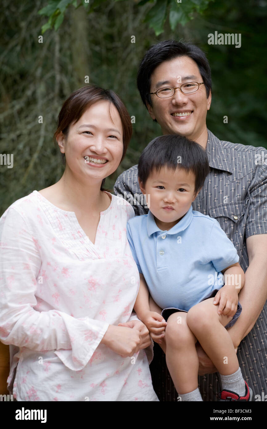 Smiling Asian family Stock Photo - Alamy