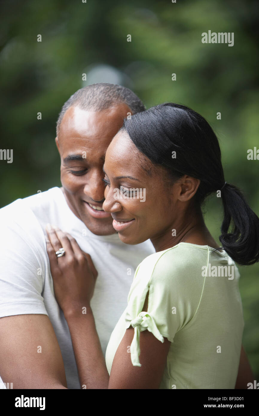 African couple hugging outdoors Stock Photo - Alamy
