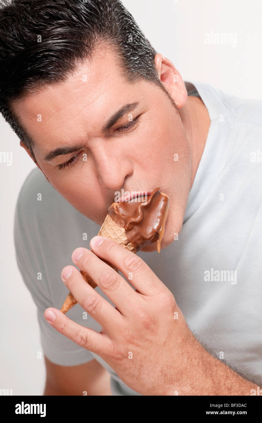Man eating ice cream cone hi-res stock photography and images - Alamy