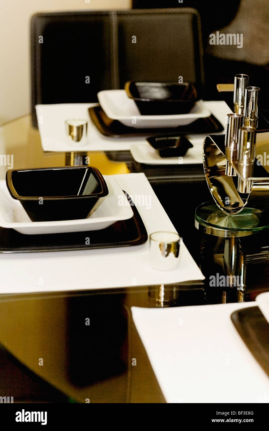 Bowls and trays on a dining table Stock Photo - Alamy