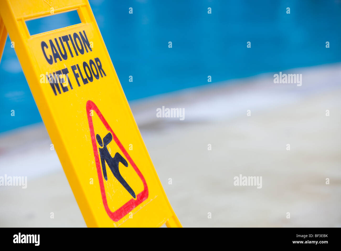 A caution sign on the edge of a swimming pool Stock Photo - Alamy