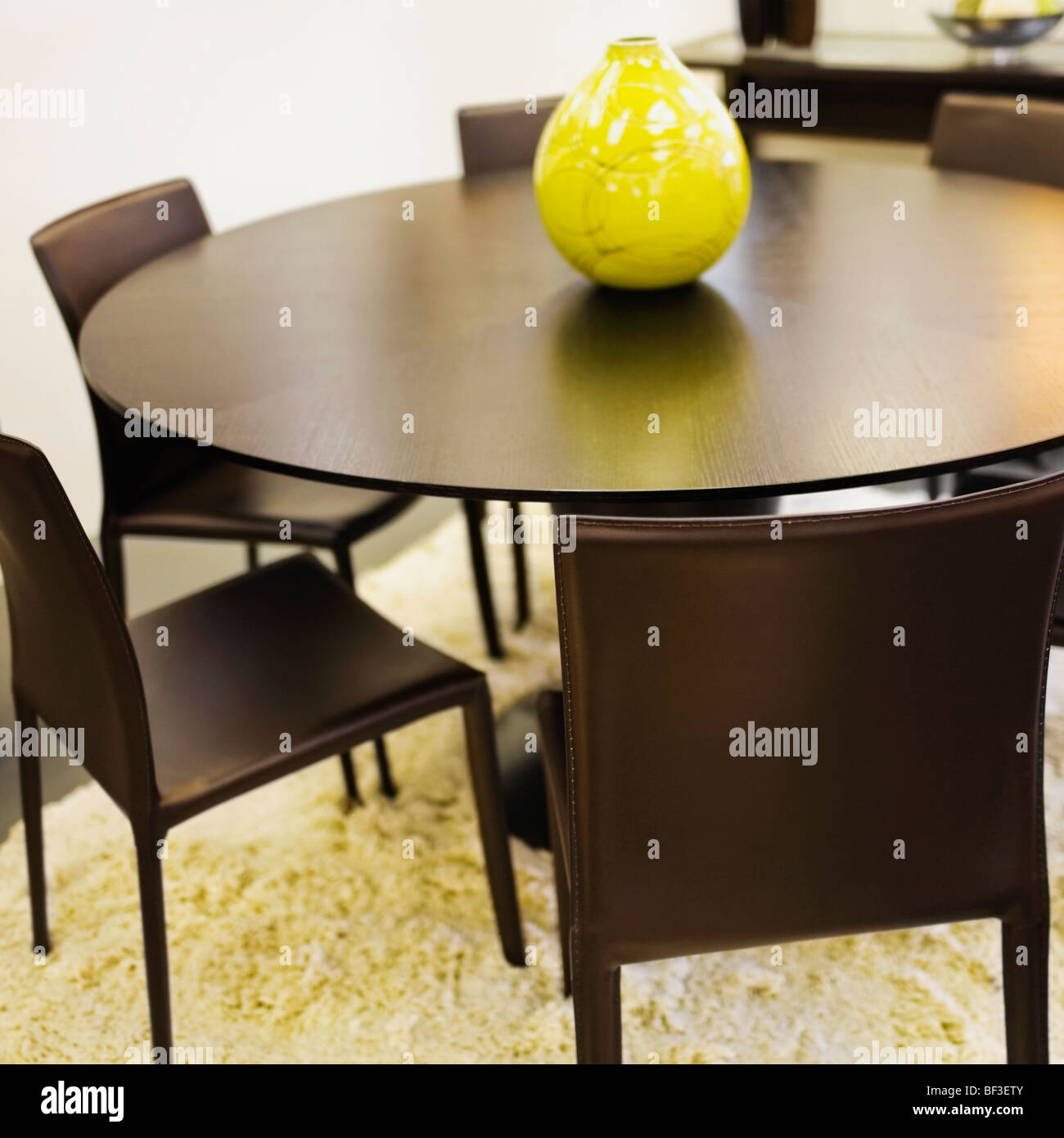 Vase on a dining table Stock Photo - Alamy