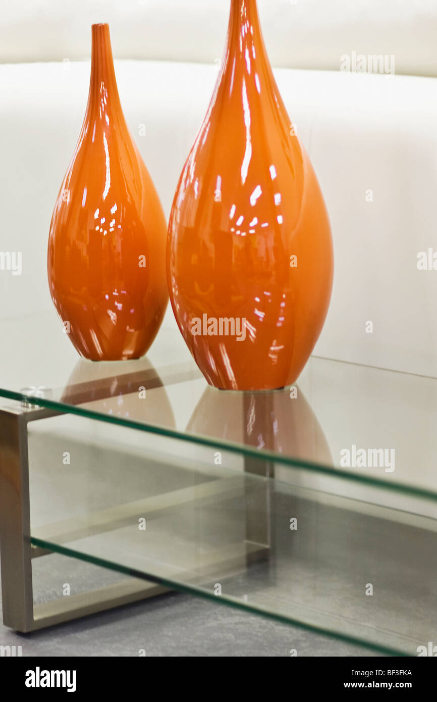 Vases on a glass table Stock Photo - Alamy
