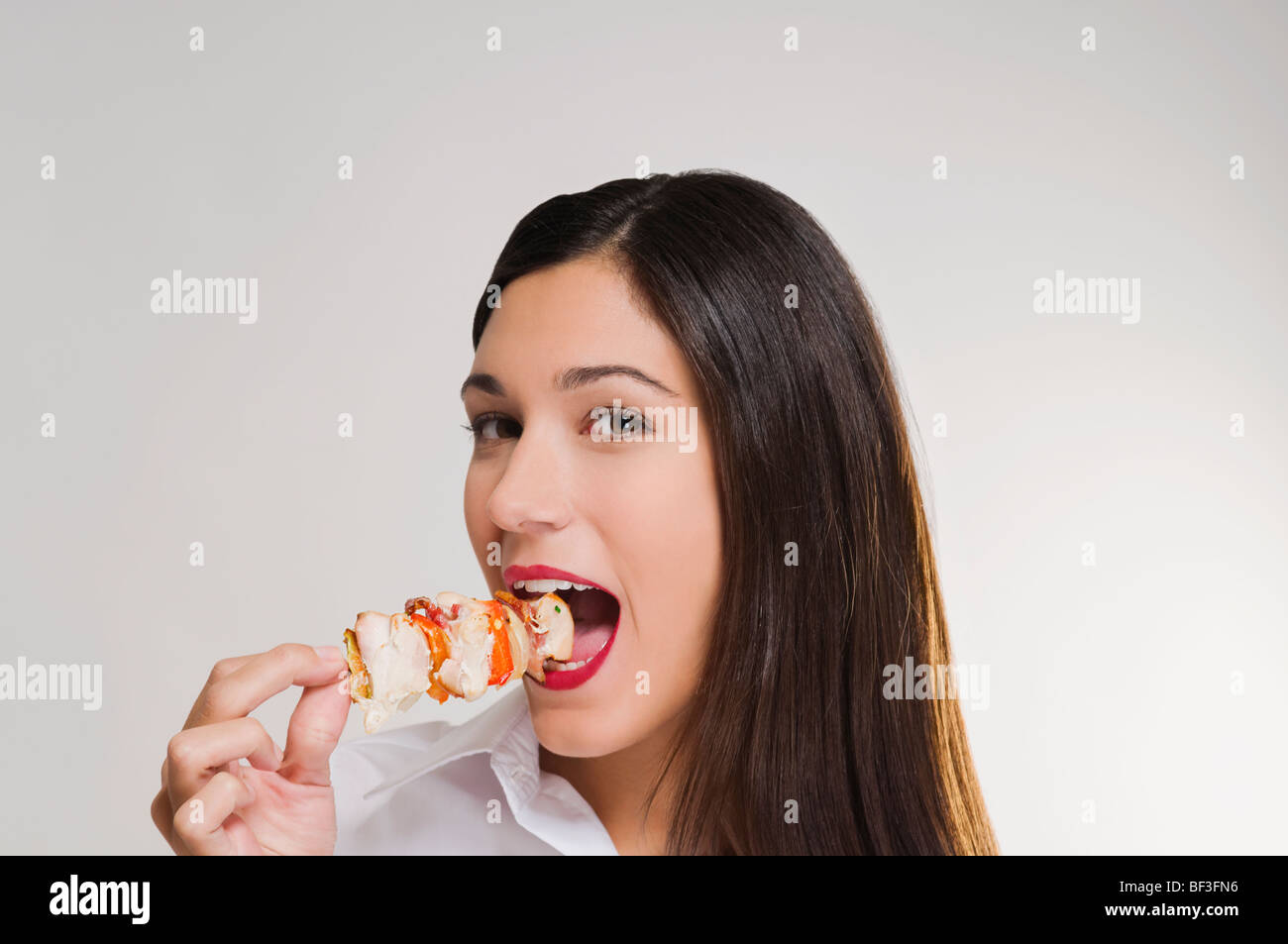 Woman eating kebab hi-res stock photography and images - Alamy