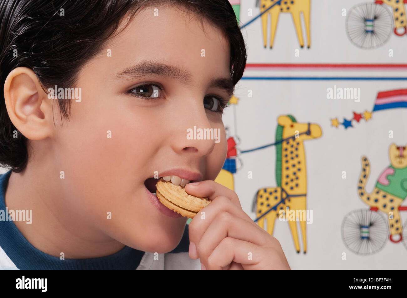 Black child eating cookie hi-res stock photography and images - Alamy