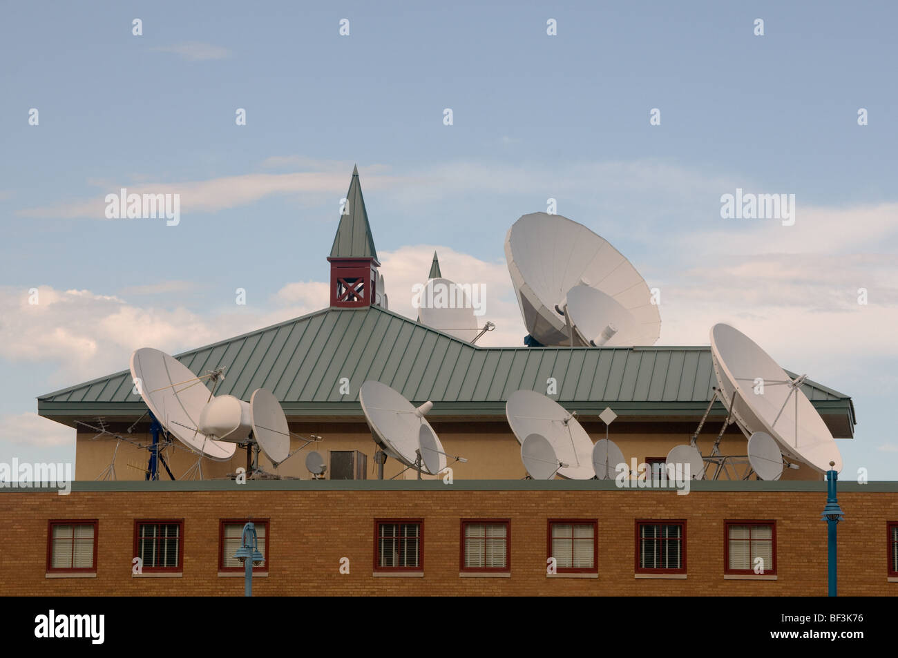 a large collection of communication and broadcast satellite dishes on a ...