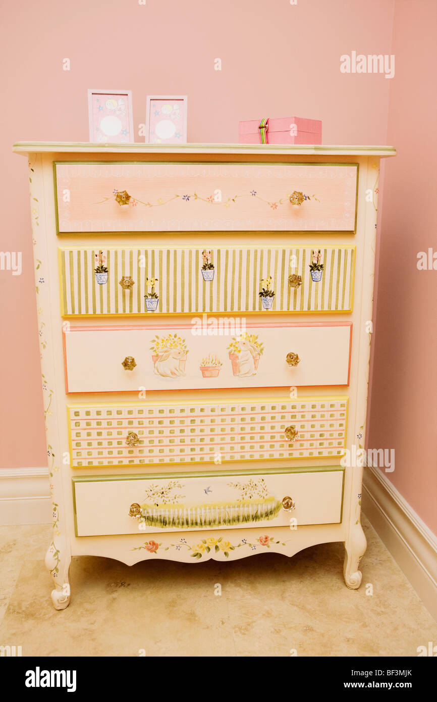 Picture frames with a box on a sideboard Stock Photo - Alamy