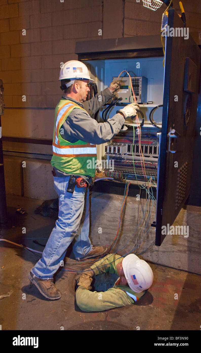 Chicago, Illinois - Public employees working on electrical wiring Stock ...