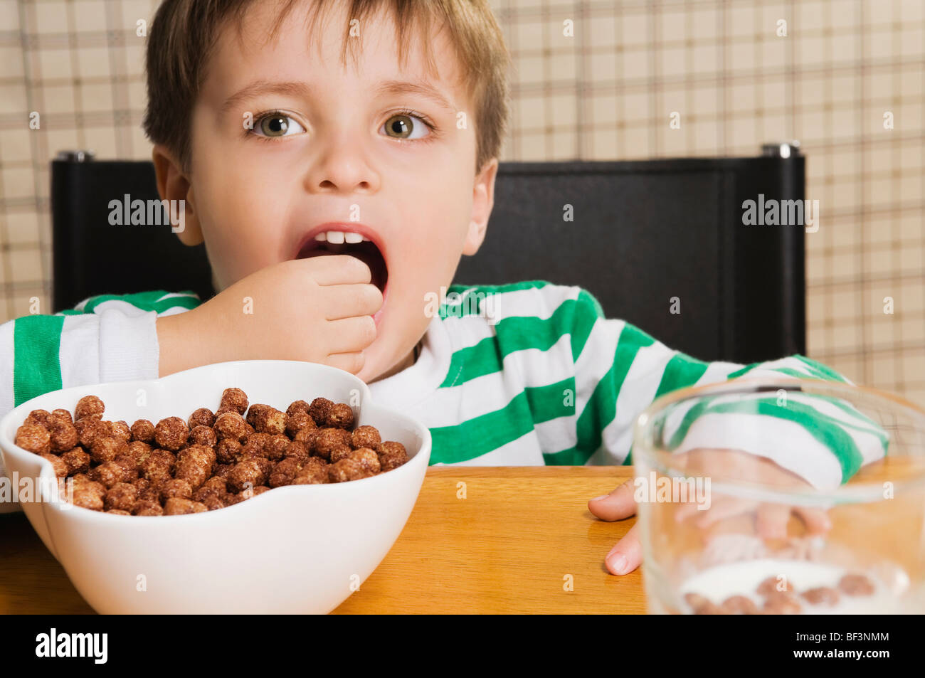 Boy eating cereal mouth open close up hi-res stock photography and ...