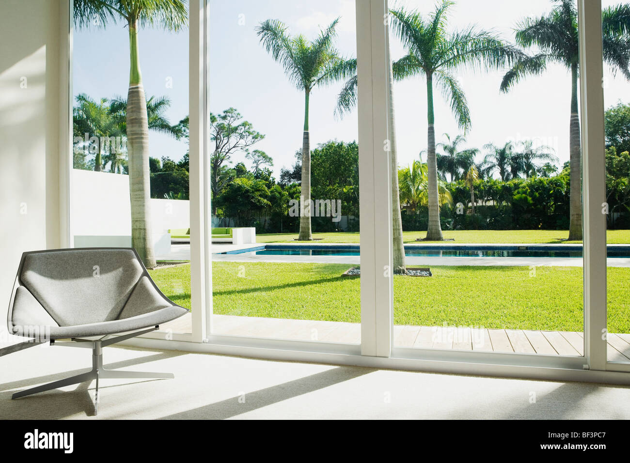 Chair near a window Stock Photo - Alamy