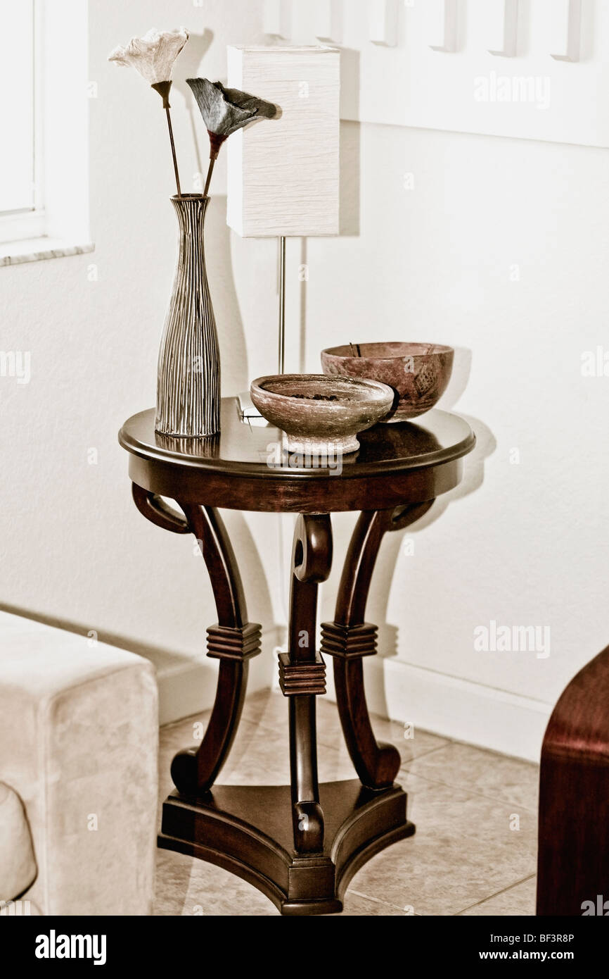 Vase with bowls on a stool Stock Photo - Alamy