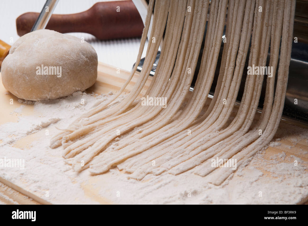 Pasta being cut with a pasta maker Stock Photo - Alamy