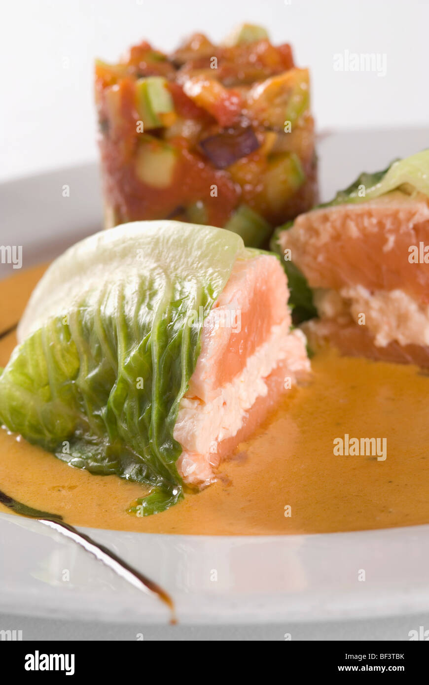 Close-up of fish steaks wrapped in cabbage leaves Stock Photo - Alamy