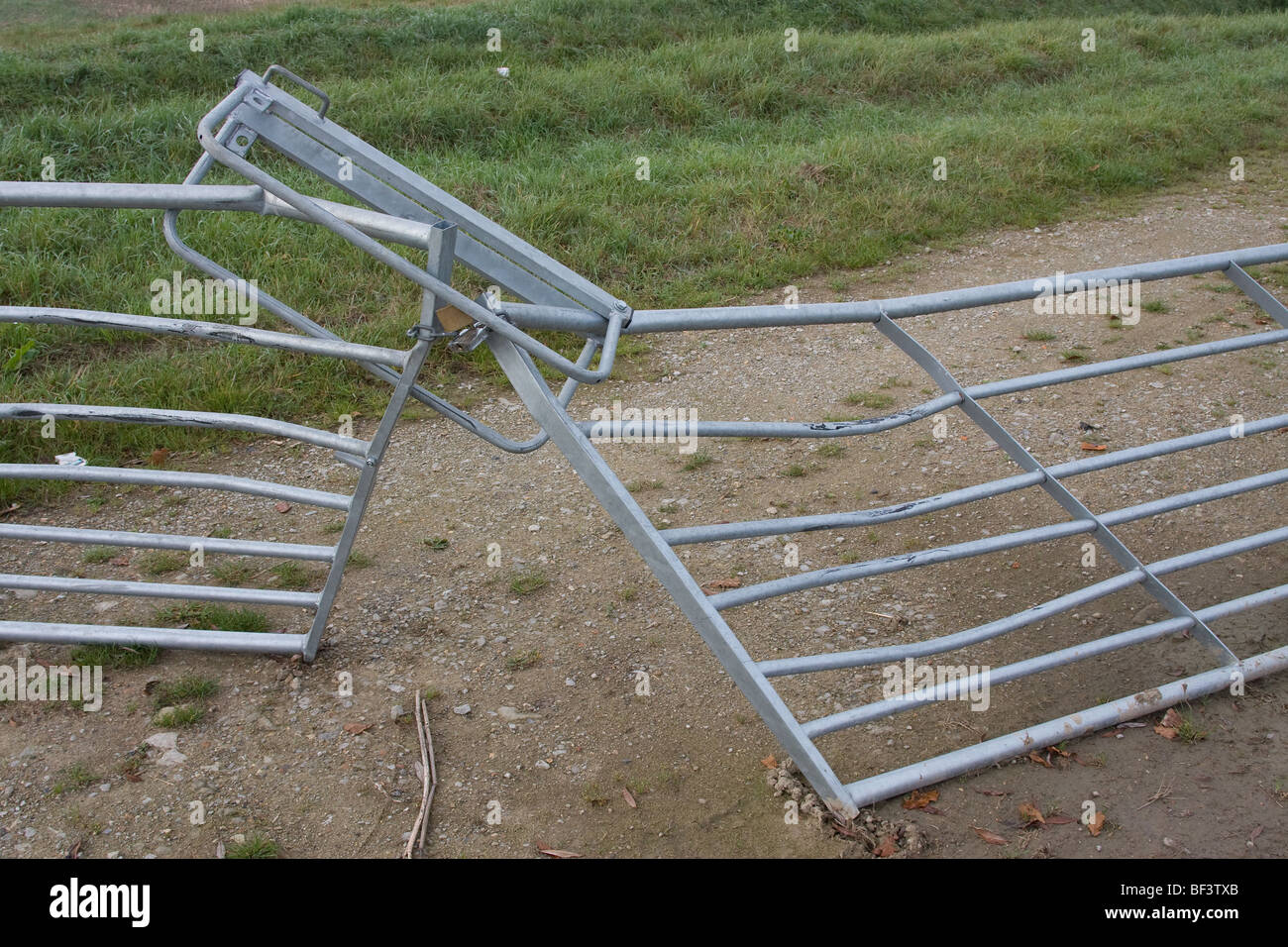broken damaged vandalised metal field track gate Stock Photo - Alamy