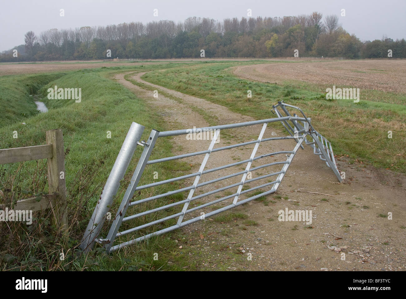 broken damaged vandalised metal field track gate Stock Photo - Alamy