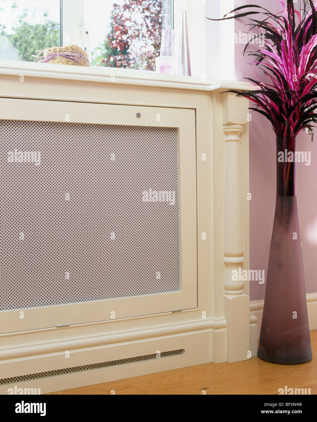 Close-up of mesh and wood radiator cover Stock Photo - Alamy