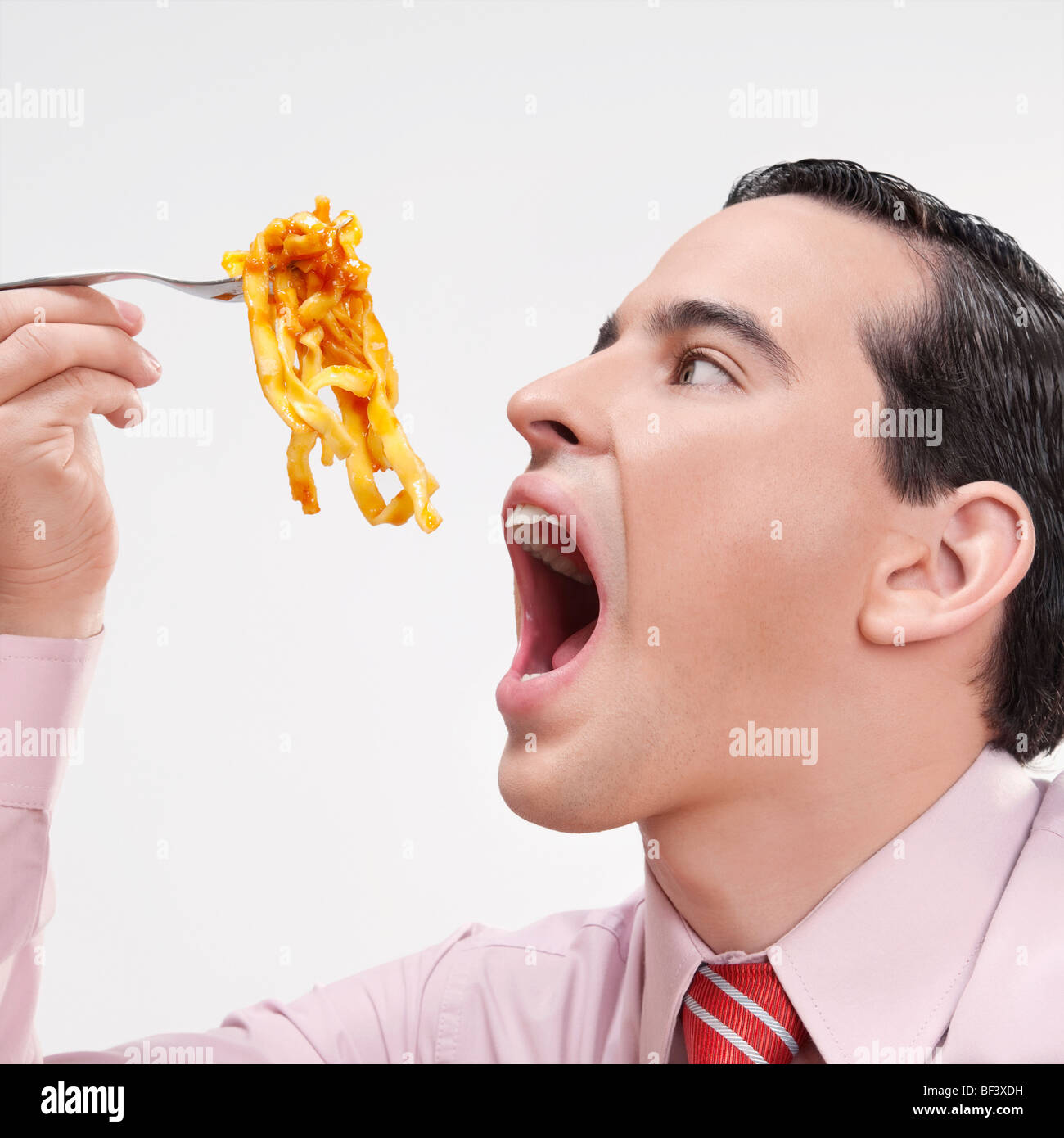 Fork spaghetti pasta mouth hi-res stock photography and images - Alamy