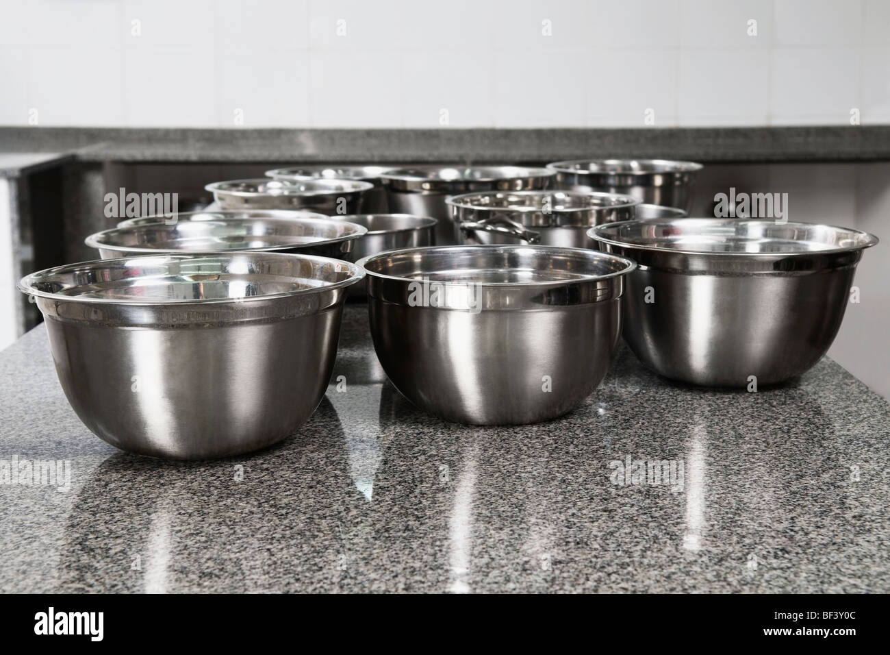 Stainless steel bowls on a kitchen counter Stock Photo - Alamy