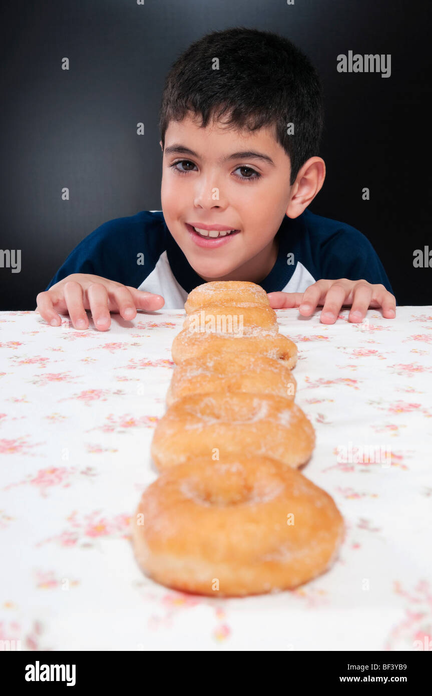 Boy with a donut hi-res stock photography and images - Alamy