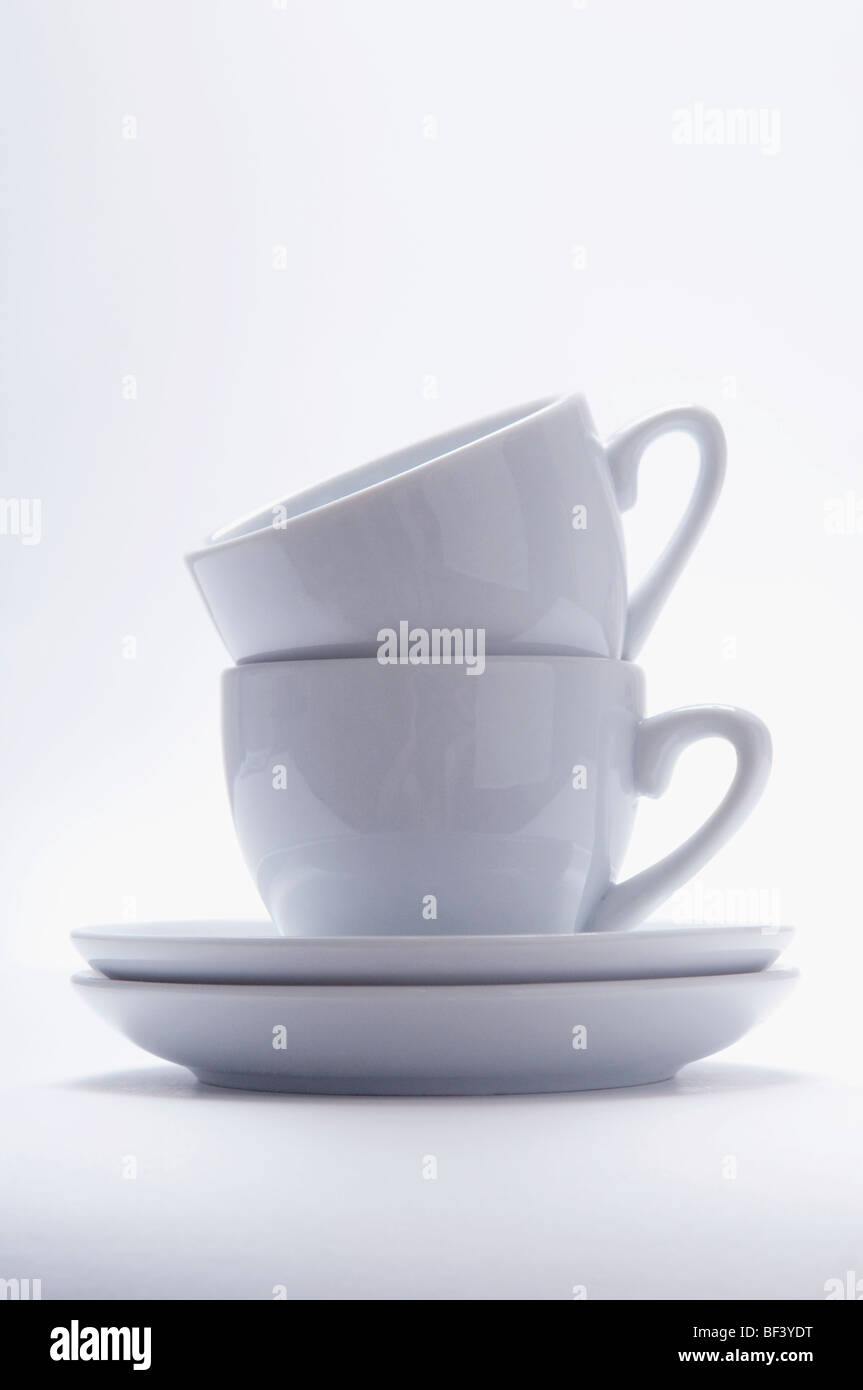 Close-up of a pile of two cups and saucers Stock Photo - Alamy