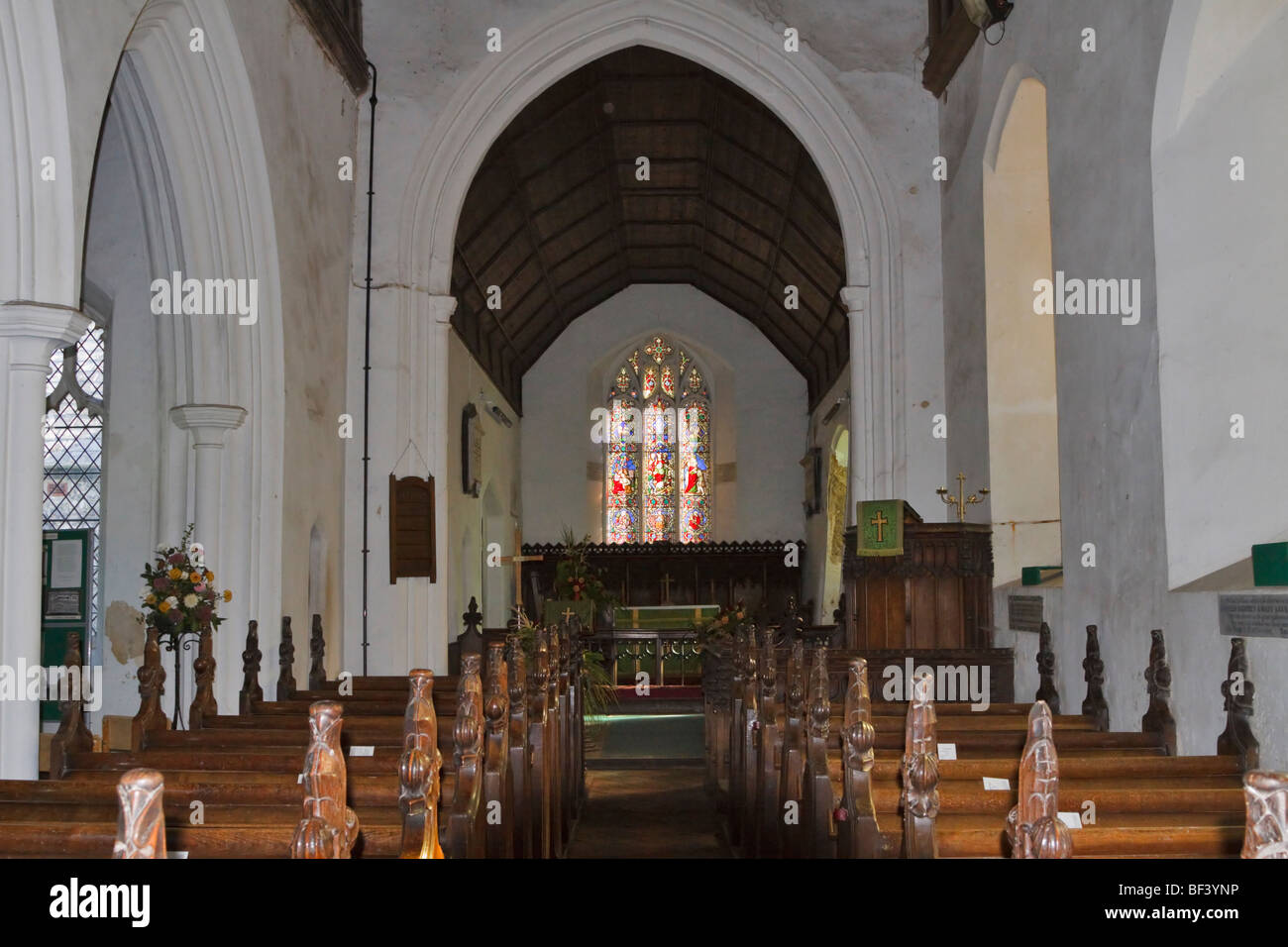 The round-tower church of Burgh Castle St Peter and St Paul Stock Photo ...