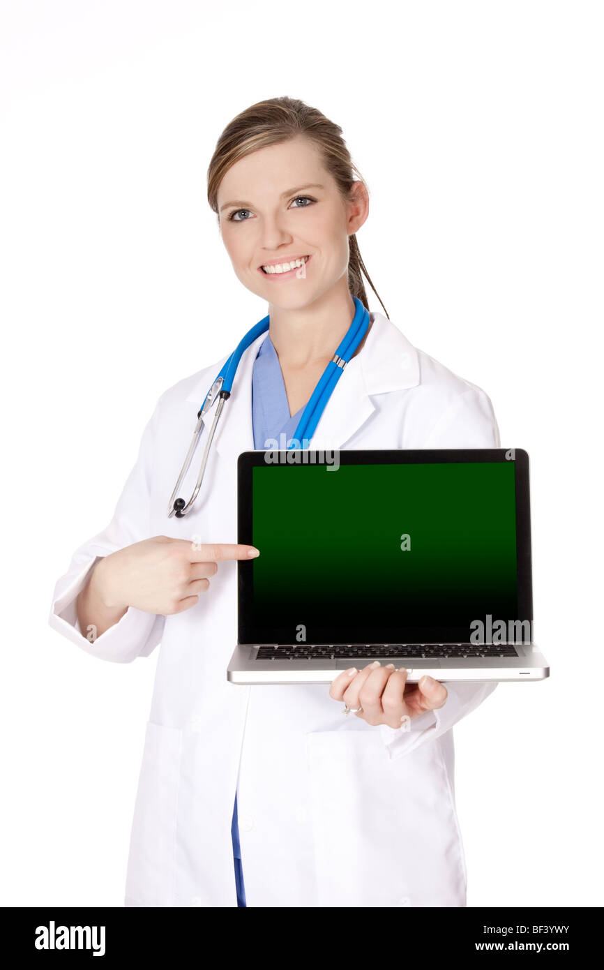 Beautiful Caucasian doctor holding a laptop computer and pointing at ...