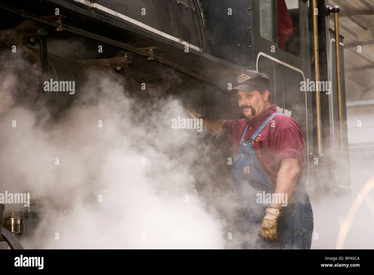 Engineer bleeding steam from the number 75 Flagg Coal locomotive, a ...