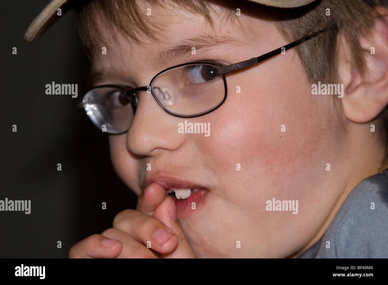 Closeup of a young boy in glasses Stock Photo - Alamy