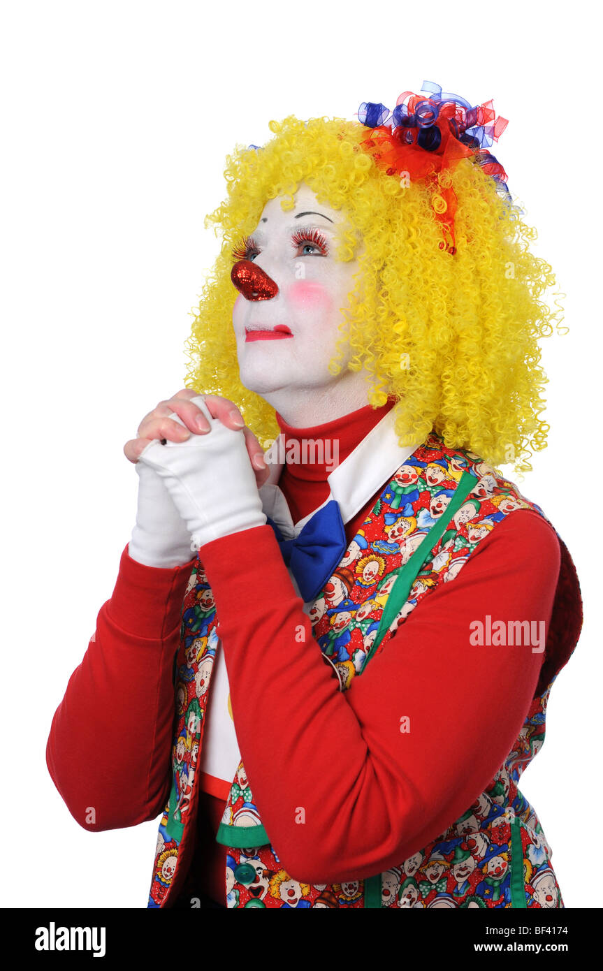 Clown with yellow hair praying isolated over a white background Stock ...