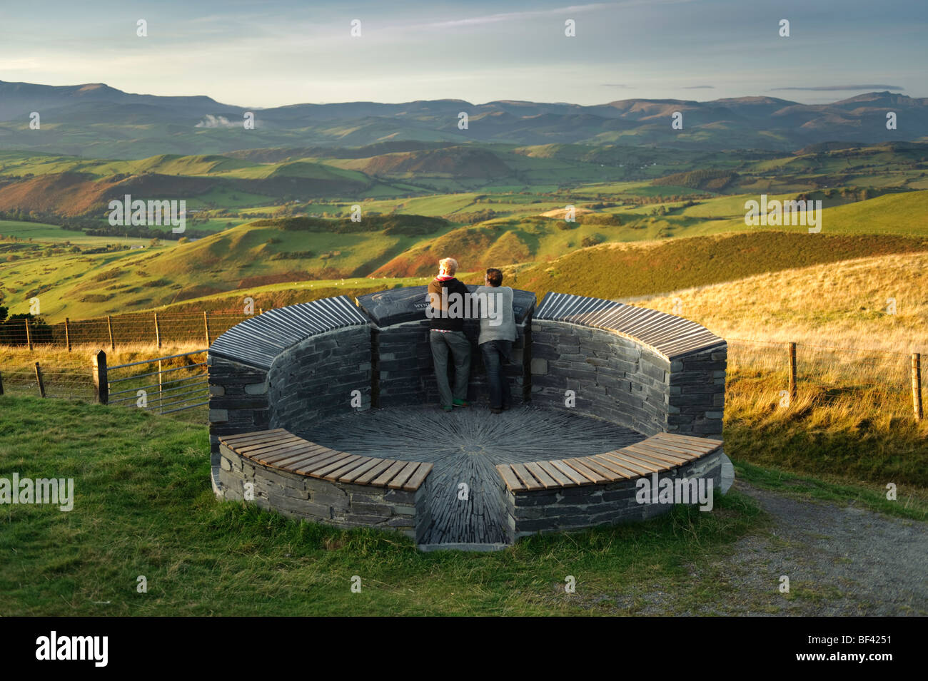 A couple of tourists admiring view of north powys from the Wynford ...