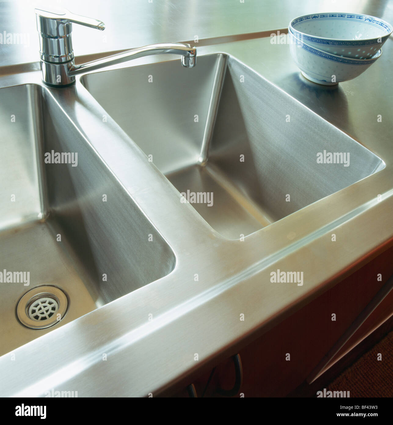 Close-up of stainless-steel double sink and mixer tap Stock Photo - Alamy