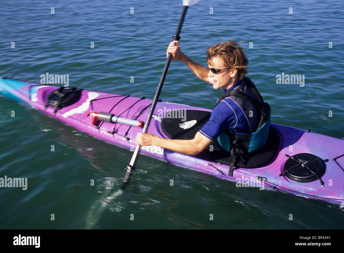Man sea kayaking Stock Photo - Alamy
