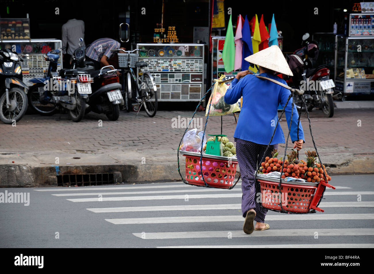 woman carrying transporting carry transport very heavy load overloaded ...