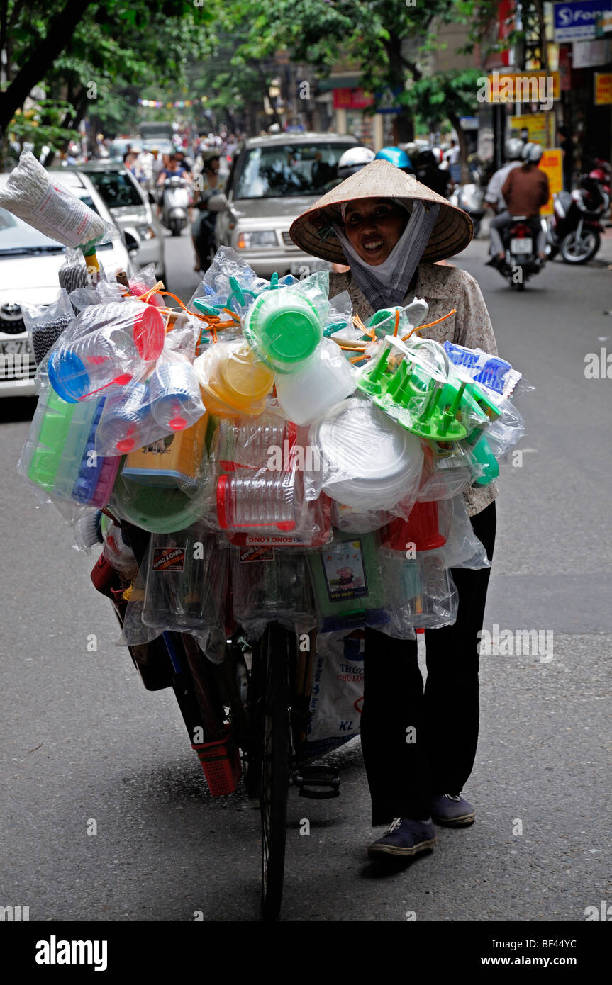 woman carrying transporting carry transport very heavy load overloaded ...