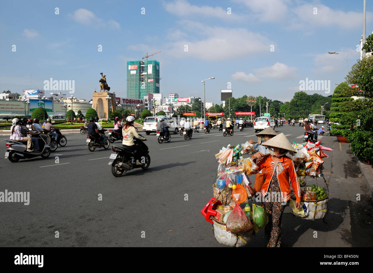 woman carrying transporting carry transport very heavy load overloaded ...