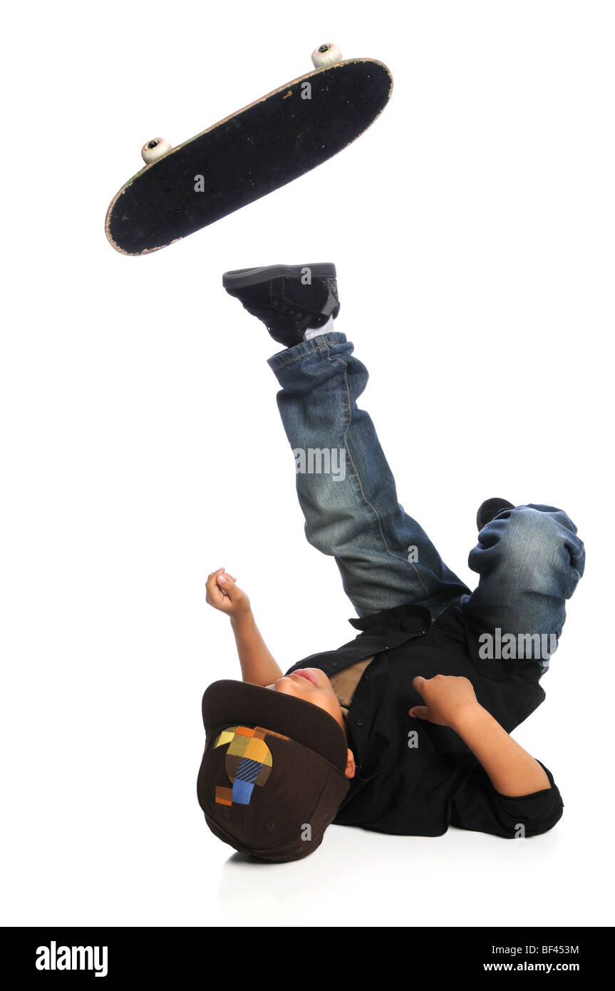 Young African American skateboarder falling isolated over white ...