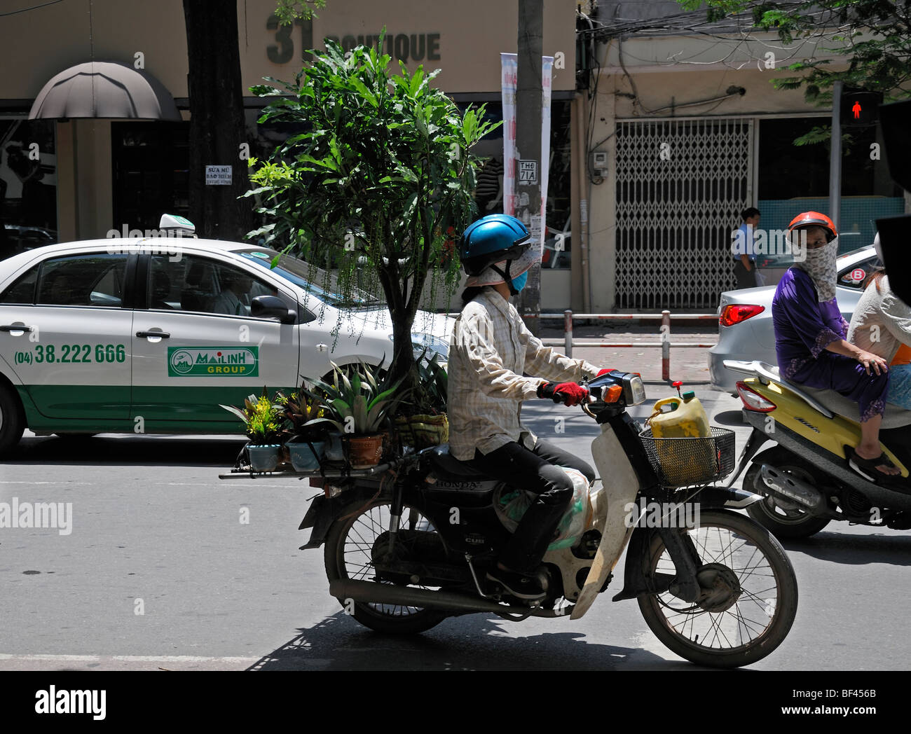 man carrying transporting carry transport very heavy load overloaded ...